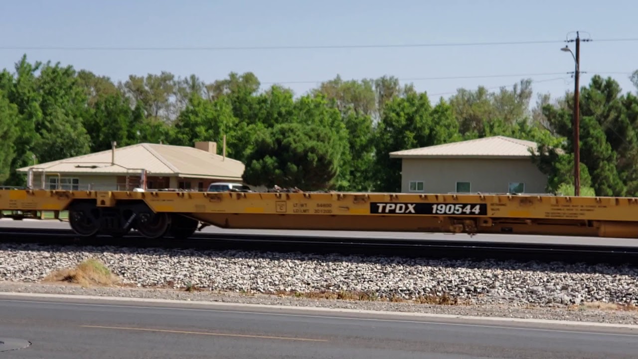 EB Union Pacific empty flat cars train using foreign power locomotives two CSX #732 and 8134 ...