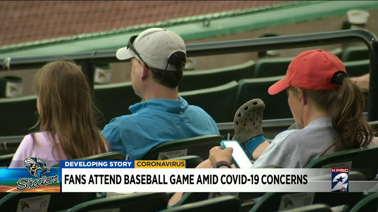 Fans attend baseball game amid COVID-19 concerns - YouTube