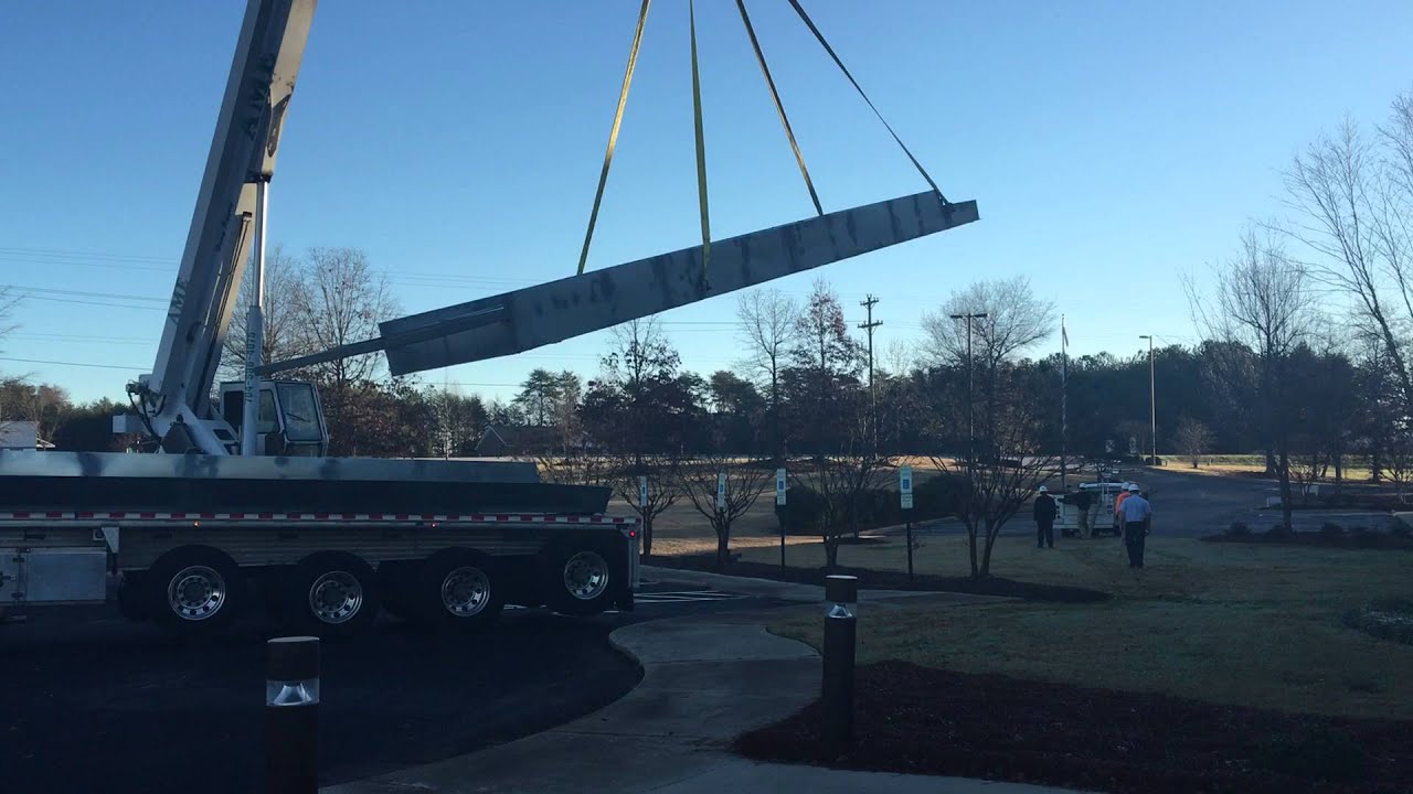 Crane offloading Roofing Curbs - YouTube