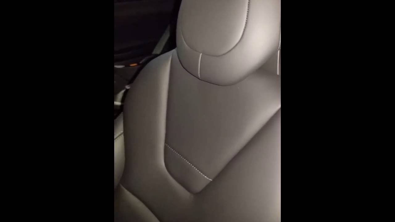 Model X seats headrests automatically move based on leg room - YouTube