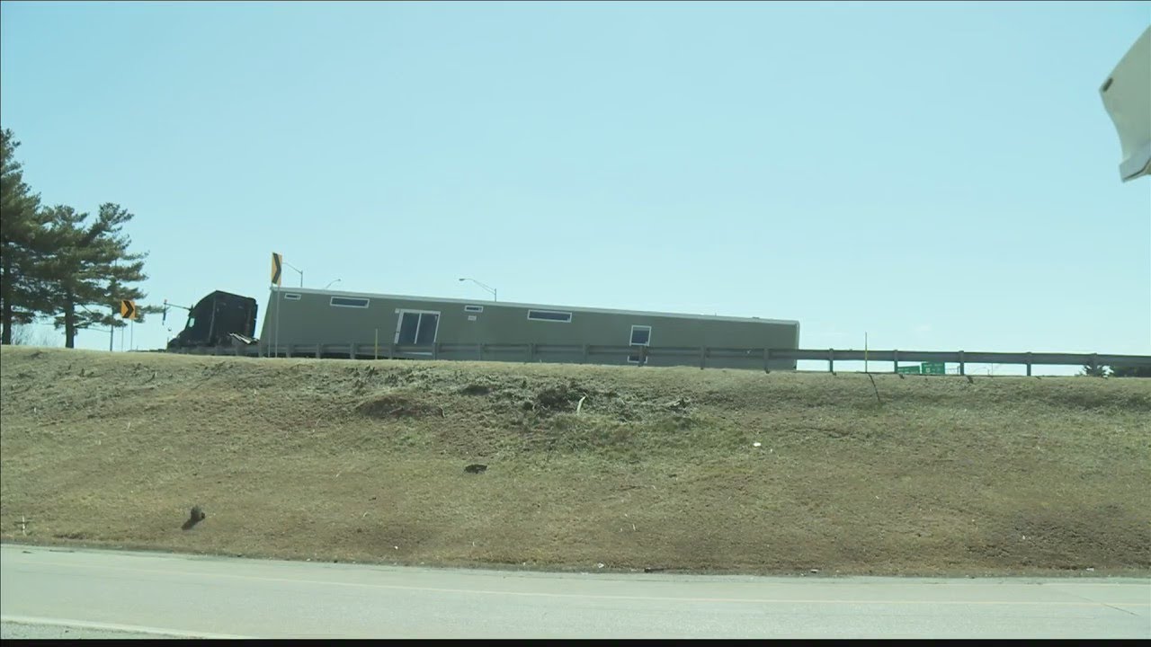 Mobile home falls off semi while being moved - YouTube