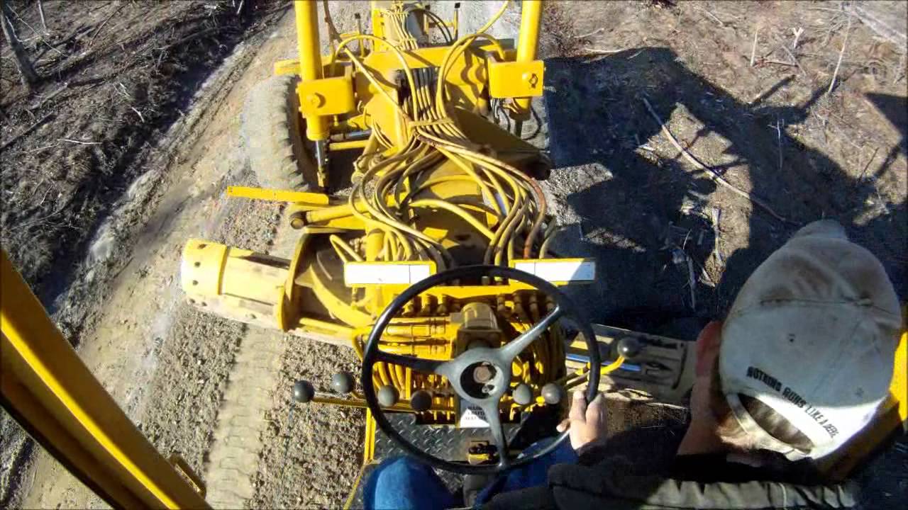 Motor Grader Grading Logging Road - YouTube