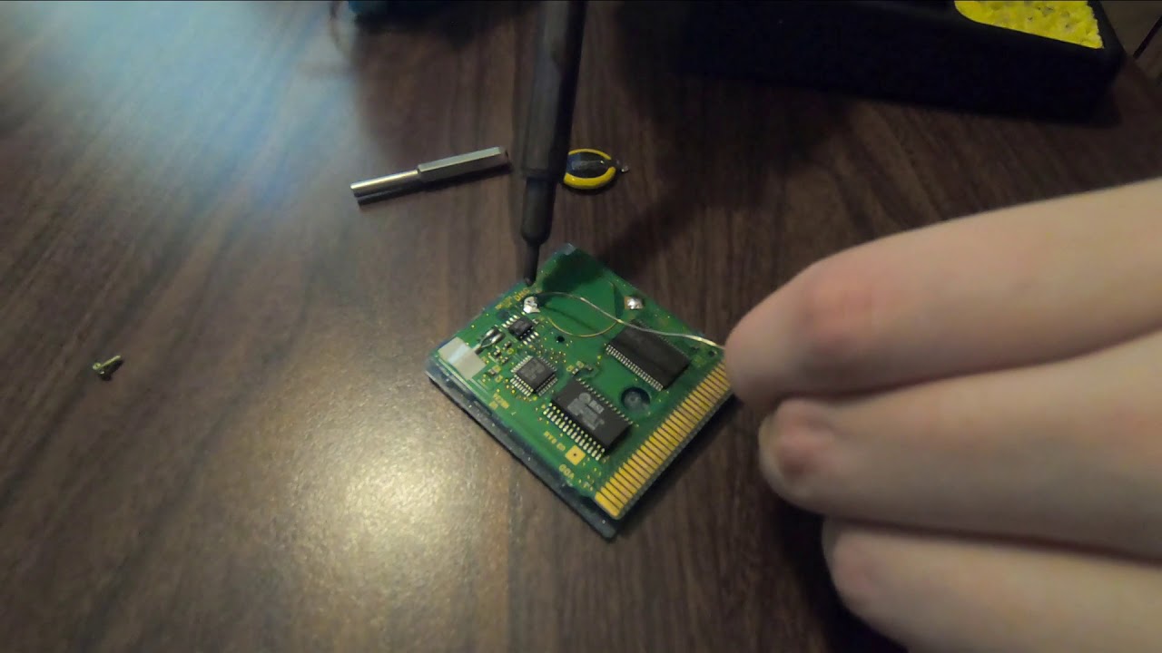 Changing the battery on Two gameboy color pokemon games crystal and ...