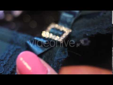 Female Hand Touching Malachite Lace Bra