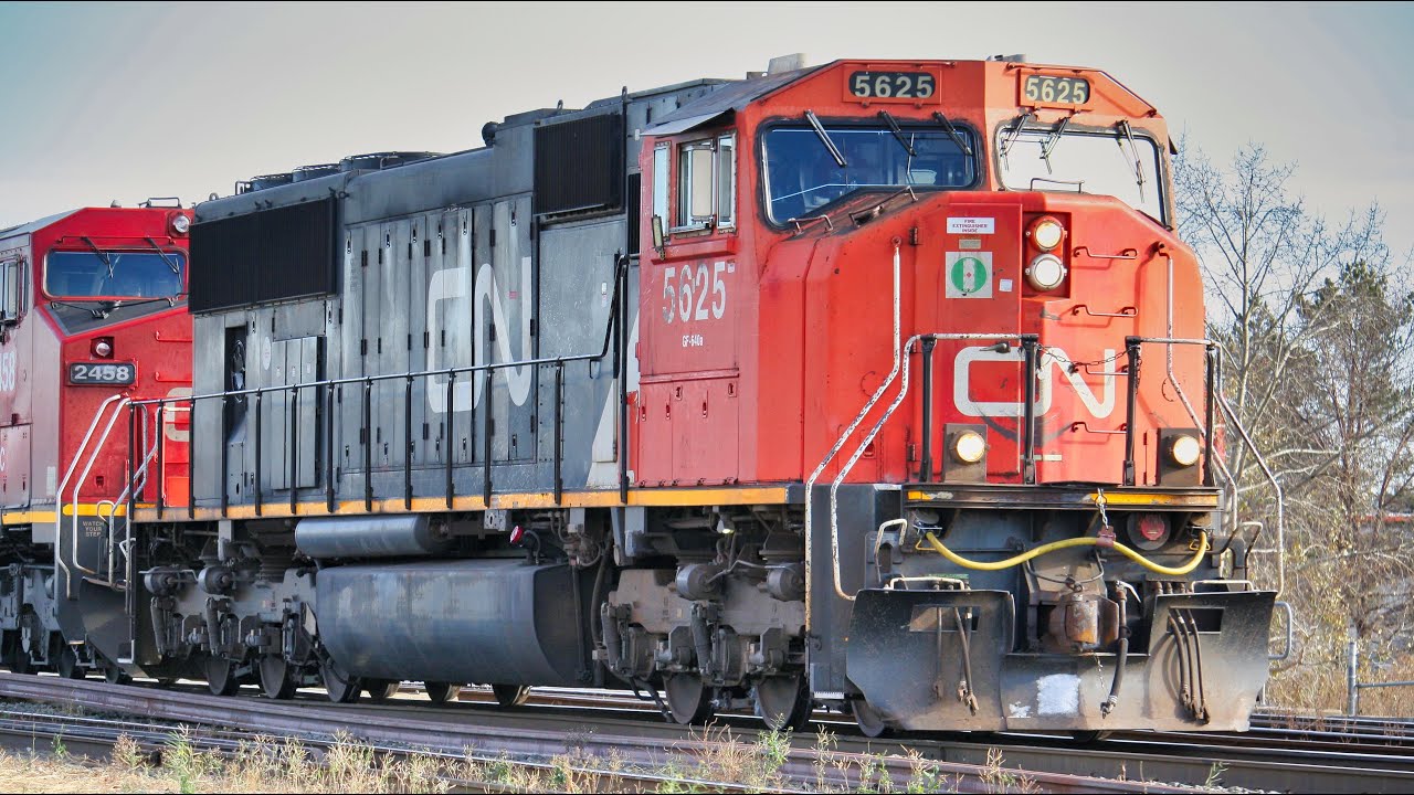 CN 5625 and IC 2458 Lead a Long Empty Centerbeam Train on the Edson Sub ...