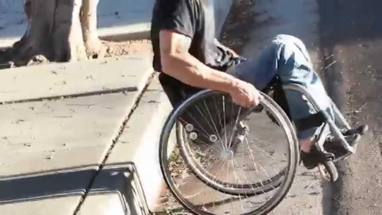 WHEELCHAIR DROPPING OFF A CURB W/ LESS IMPACT. #wheelchair - YouTube