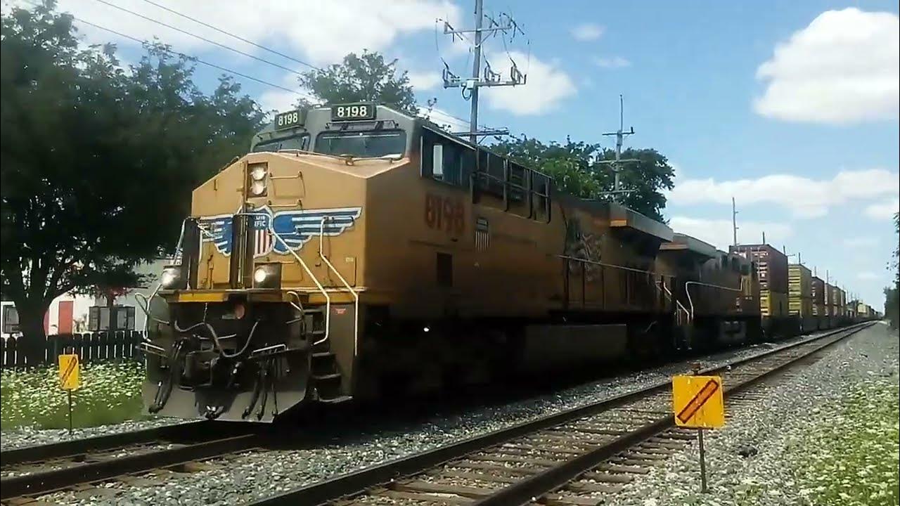 Union Pacific #8198 and #7788 is passing by the 95th Street Railroad Crossing in Evergreen Park ...