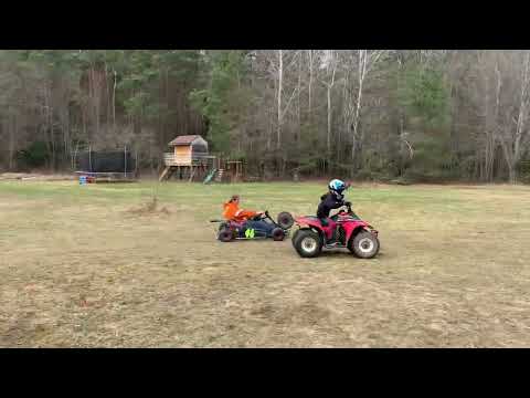 Finley racing go kart on grass - YouTube