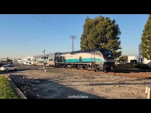 11/3/23 Pre: EB M688 with Metrolink Bombardier repaint SCAX 187 passes Los Nietos/SFS crossings ...