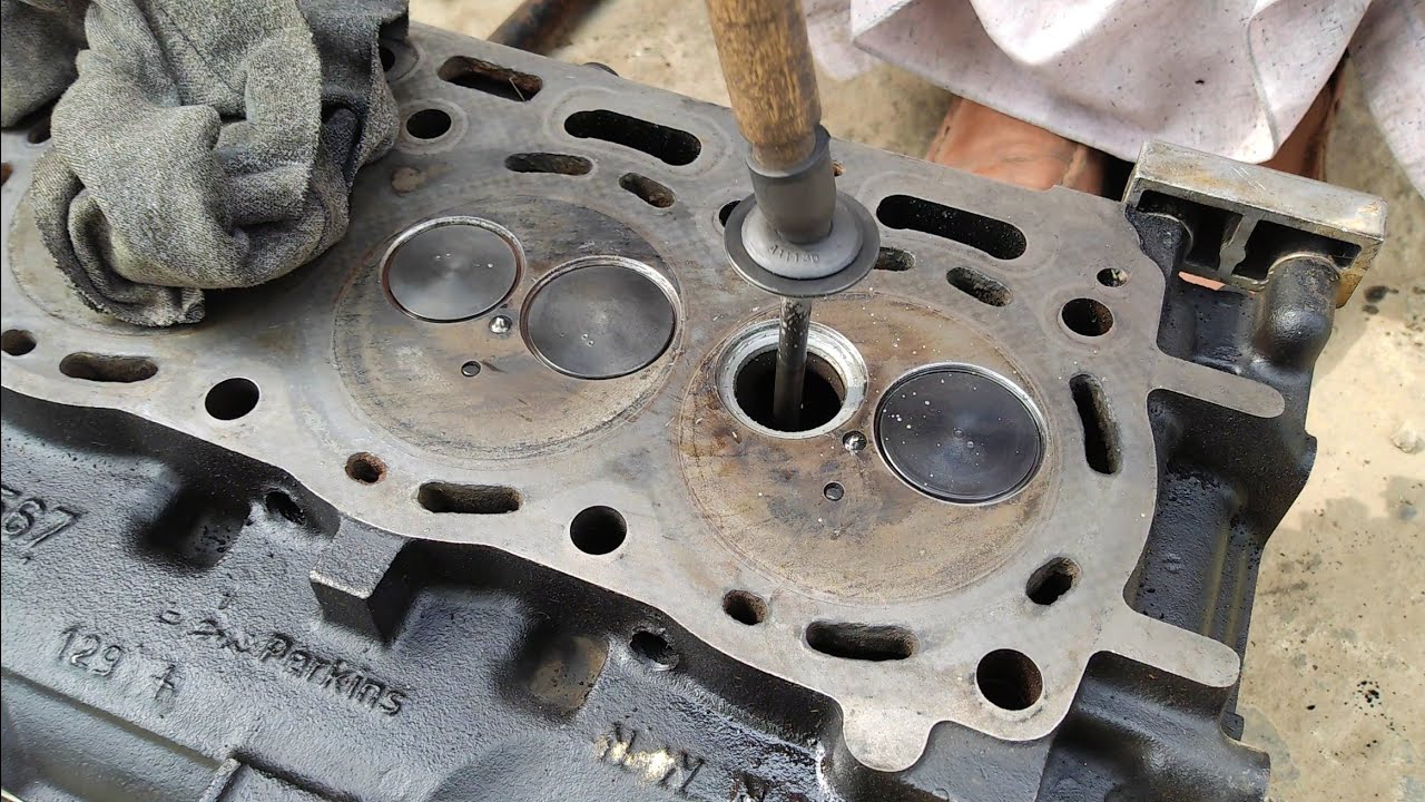 Tractor engine head valve granding - YouTube