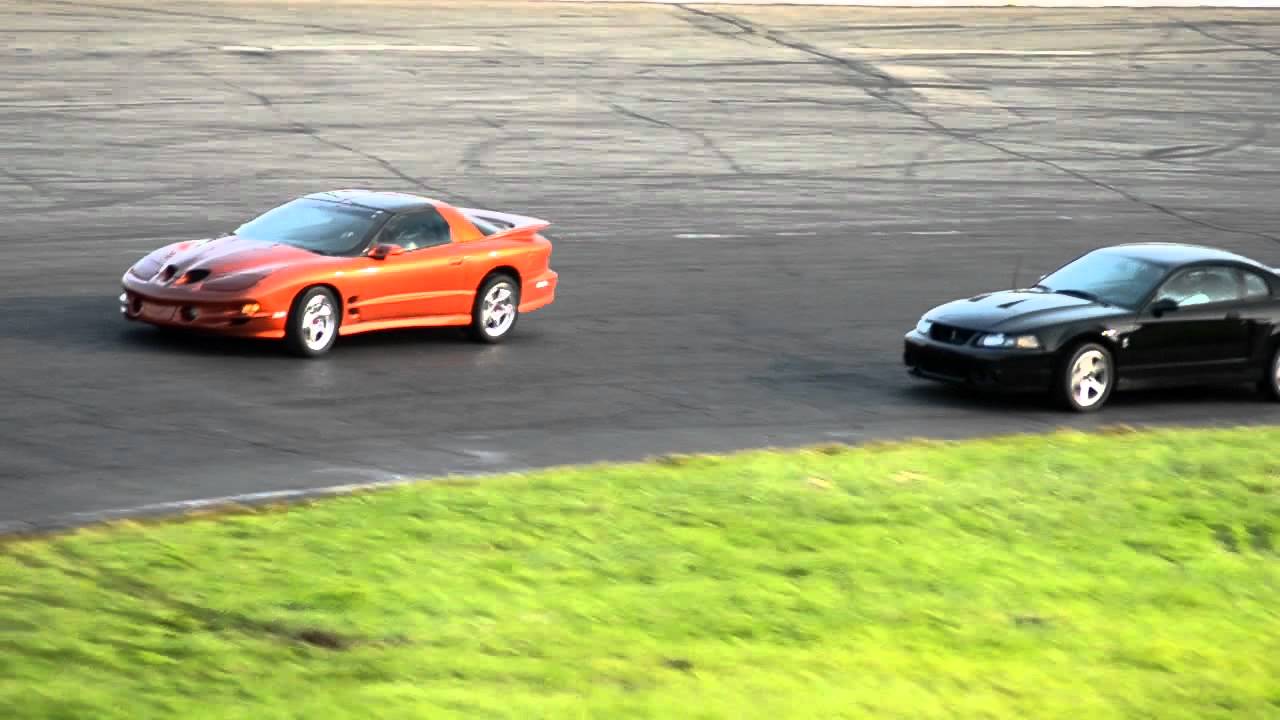 04 Mustang Cobra vs Trans AM on 1/4 mile oval track - YouTube