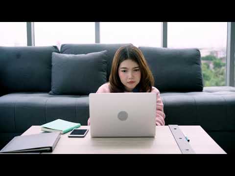 Young Asian Woman Working With A Laptop Looking Tired   Free HD Video Clips & Stock Video