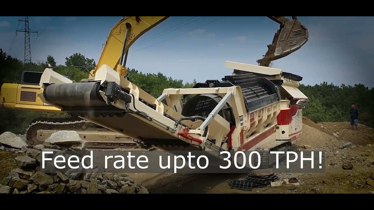 M412 trommel from MDS International processing material on site - YouTube