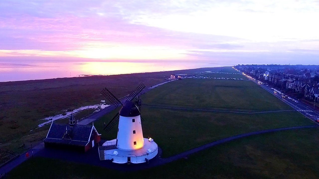 Lytham St Annes sunset, windmill, pier and beach shot from above with ...