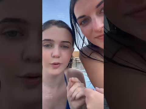 We are chatting in the pool wearing pink and blue bikinis🩱👙👭🥰🏊‍♂️👀