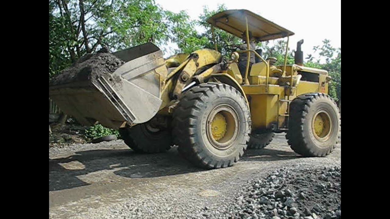 Old Wheel Loader Loading Stone Crusher - YouTube