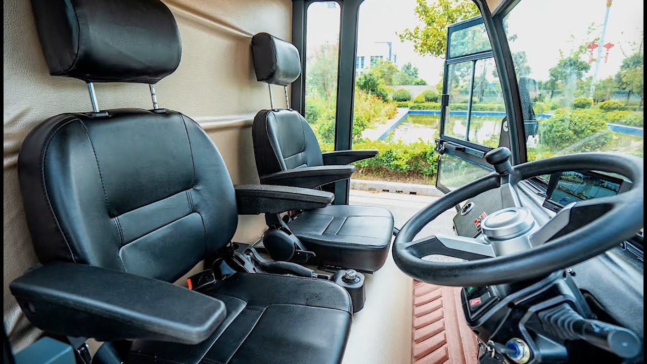 A glimpse inside the driver's cab of the LVBAO LB5035TXSEV RHD pure electric sweeper - YouTube