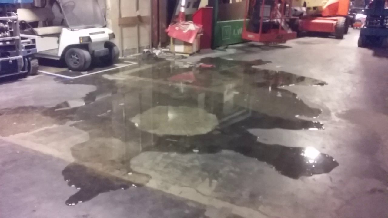 Flood water creeping into storage area at Memorial City Mall - Tropical ...