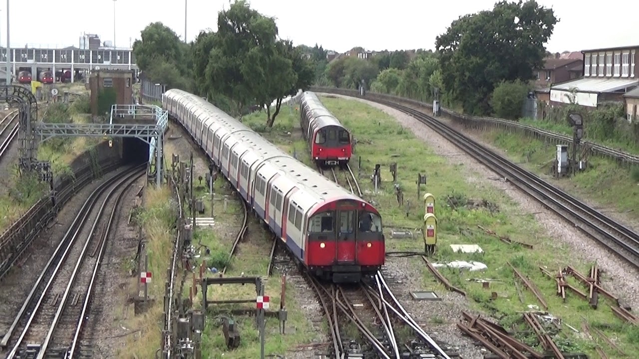 London Underground 1973 Stock 891 and 201 arriving into Northfields ...