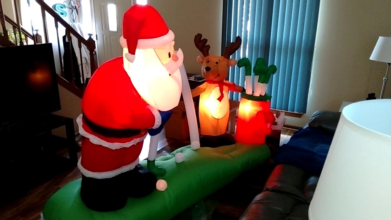 Gemmy Christmas airblown inflatable Santa Golfing - YouTube