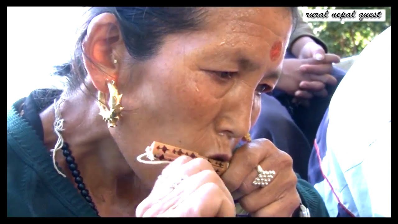 Playing BINAYO , an old traditional musical instrument from rural Nepal ...
