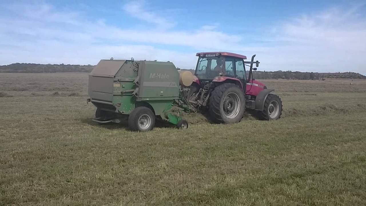 Making hay with Case mxm 120 and a Mchale 540 - YouTube
