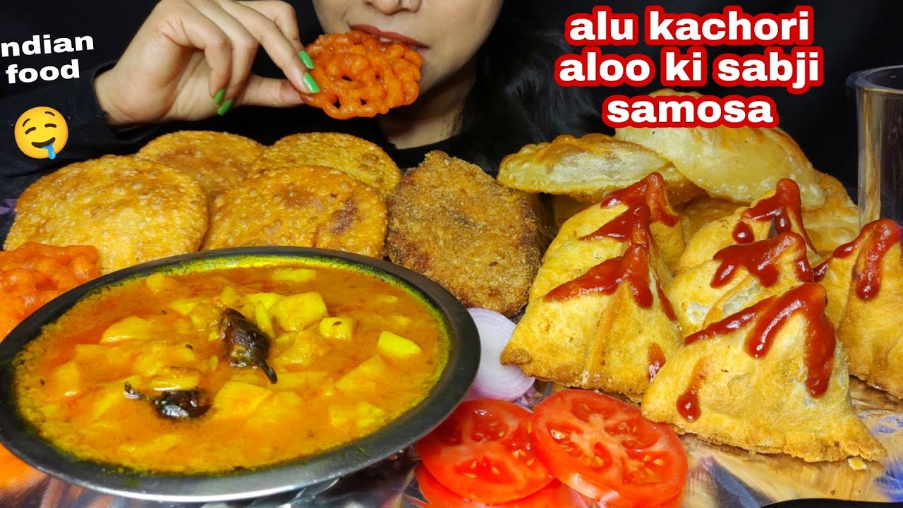 eating kachori with aloo ki sabji, samosa , chicken cutlet, puri ...