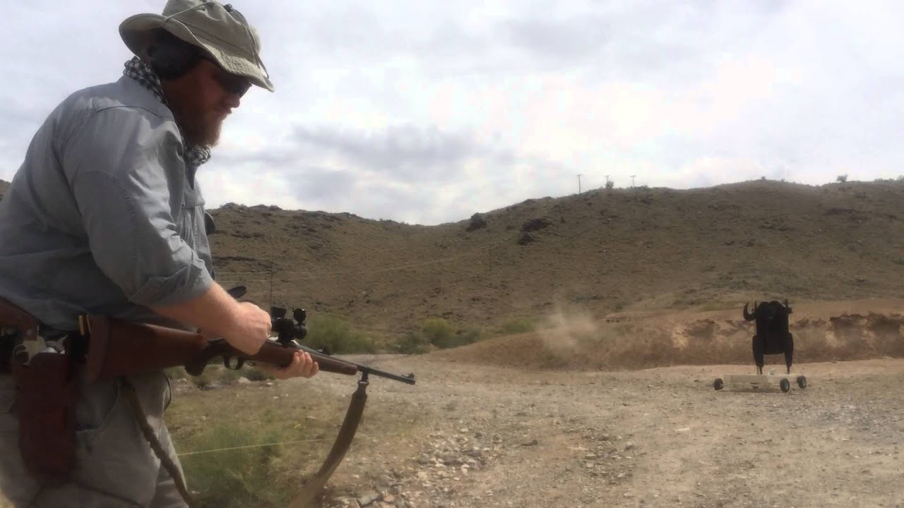 Hitting the charging Cape buffalo. - YouTube