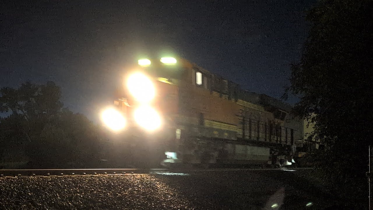BNSF 7975 leads a SB loaded military train at night!!!! - YouTube