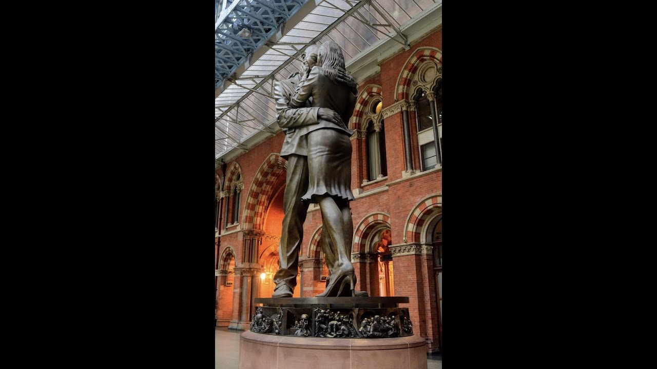 The lovers statue at St. Pancras Station London - YouTube
