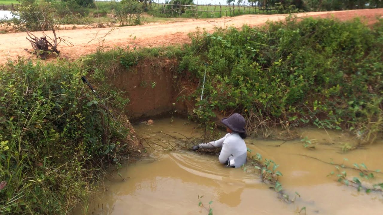 Unclogging Culvert Drain Deep Water Removing Rubbish On Culverts - YouTube
