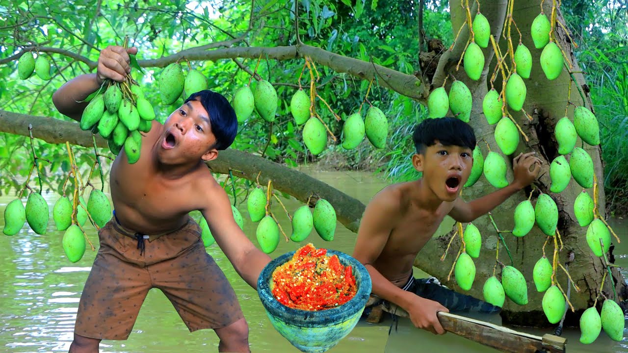 Primitive Technology - Boy with man eat mango with salt peppers ...