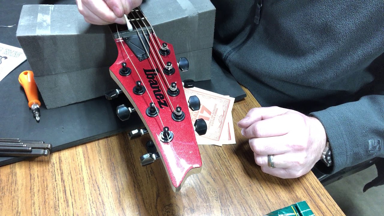 How to string a guitar the easy and reliable way Ibanez RG8 - YouTube