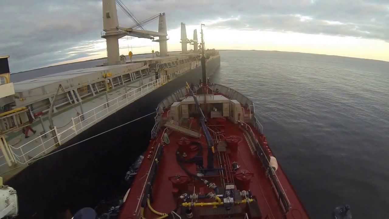 Bunker barge going alongside bulk carrier. - YouTube