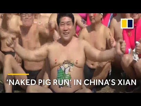 Winter swimmers strip to their underwear for China’s ‘naked pig run’