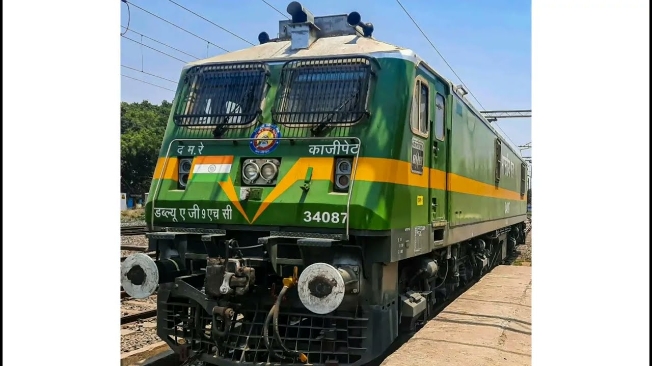 WAG9HC 34087 UNIQUELY SILVER/GREEN/YELLOW/GREEN FREIGHT ENGINE RESTS AT ...