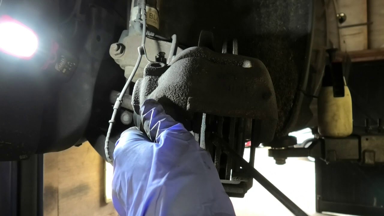 Mini Cooper 2009 front brake pads removal and replacement a guide - YouTube