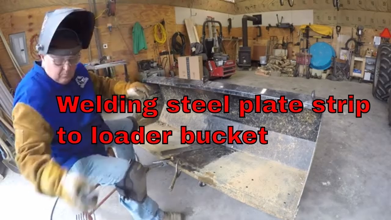 Welding steel plate to loader bucket - YouTube