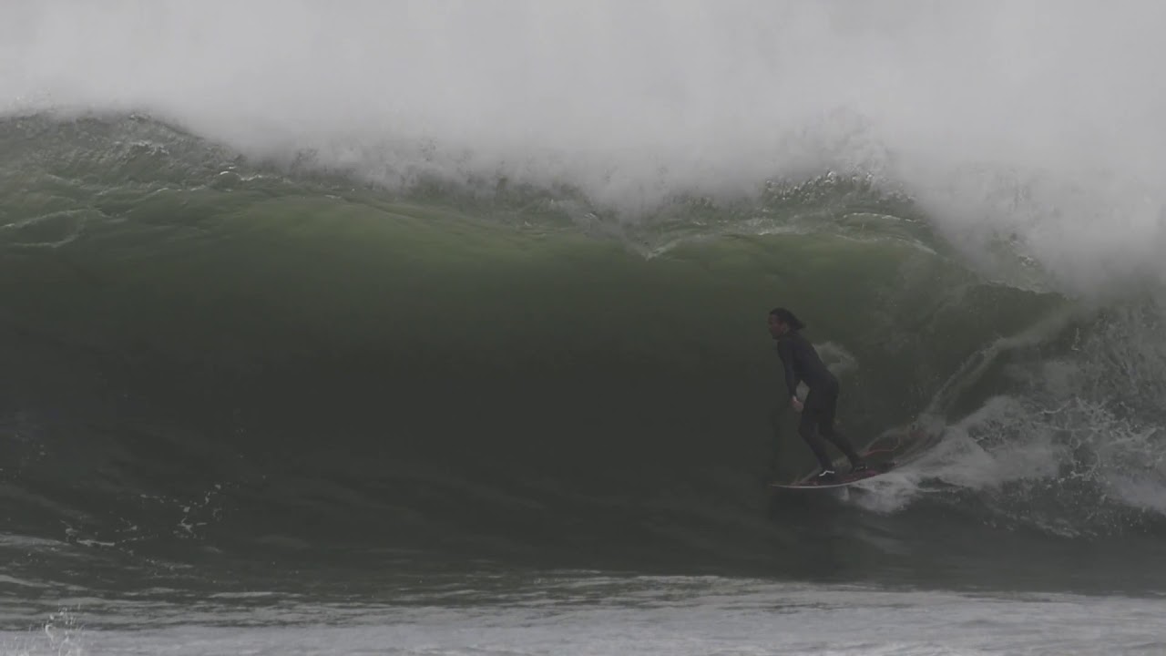 Huge Waves Splash the Breakwall in Newcastle With Surfers Slide Through ...