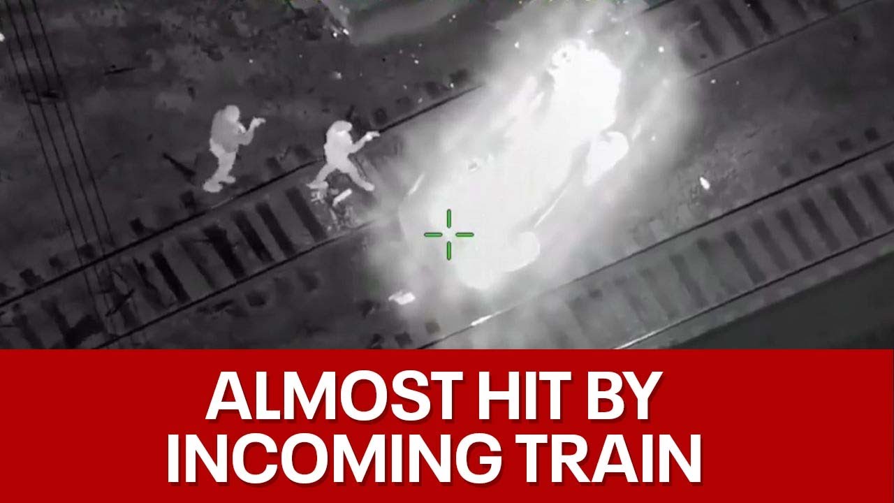 Man crashes Atlanta police car on train tracks, rescued from incoming ...