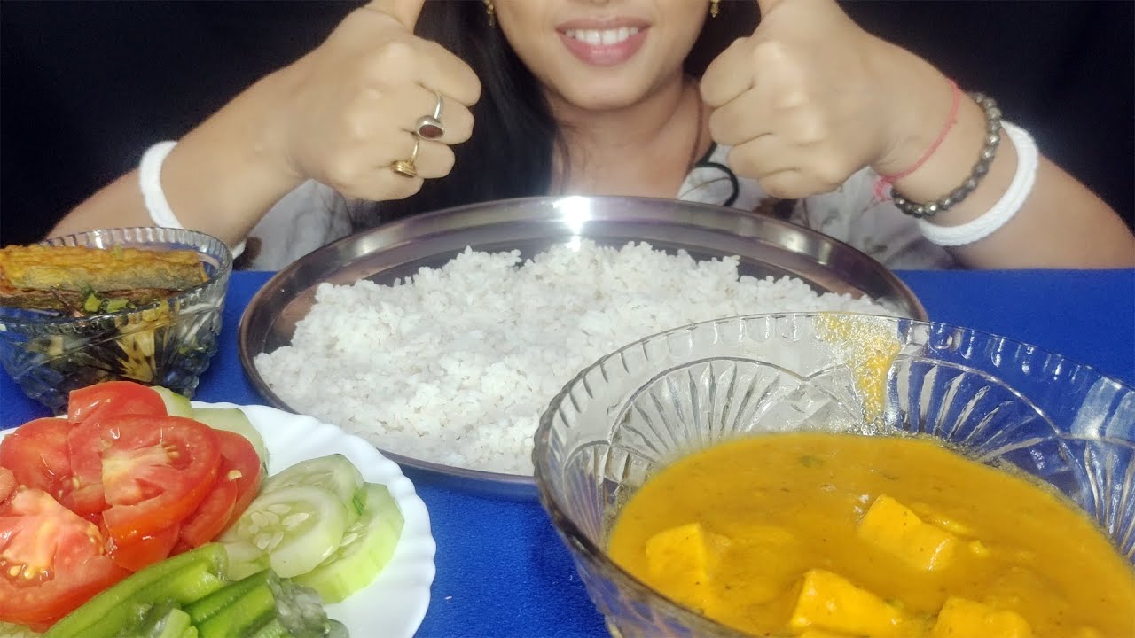 EATING TASTY PANEER BUTTER MASALA, RICE, BOILED VEGETABLES, CUCUMBER ...