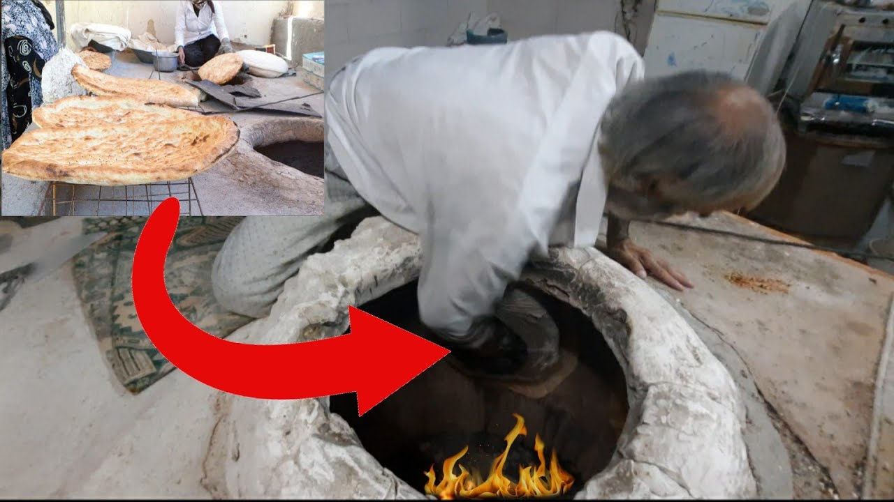 Cooking traditional tandoori bread with sesame/traditional iranian ...