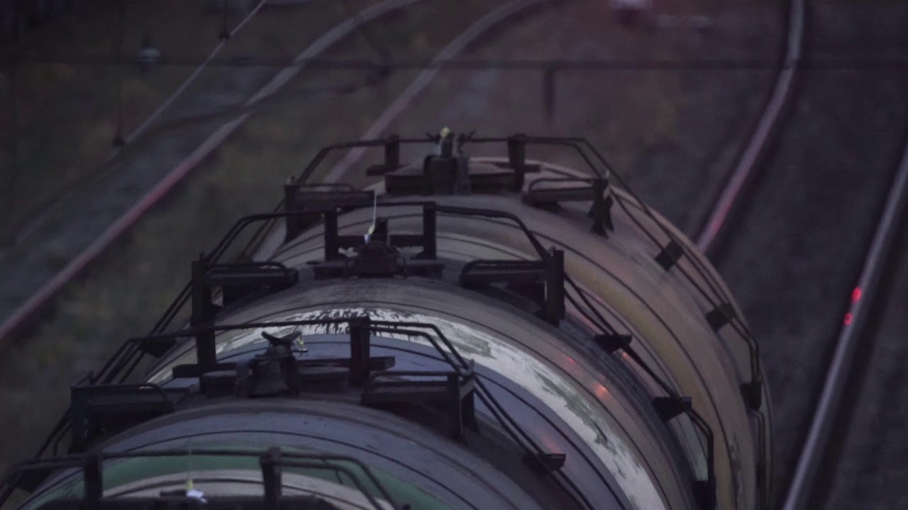 Freight train - transportation of oil in tanks by rail. Train tail ...