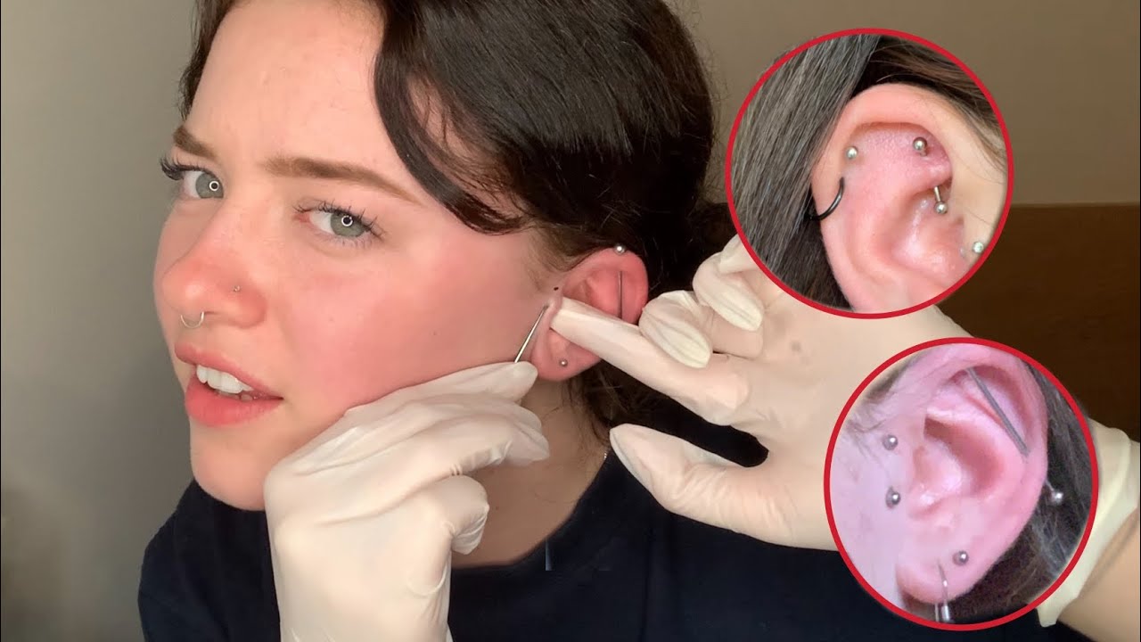 piercing my rook and vertical tragus - YouTube