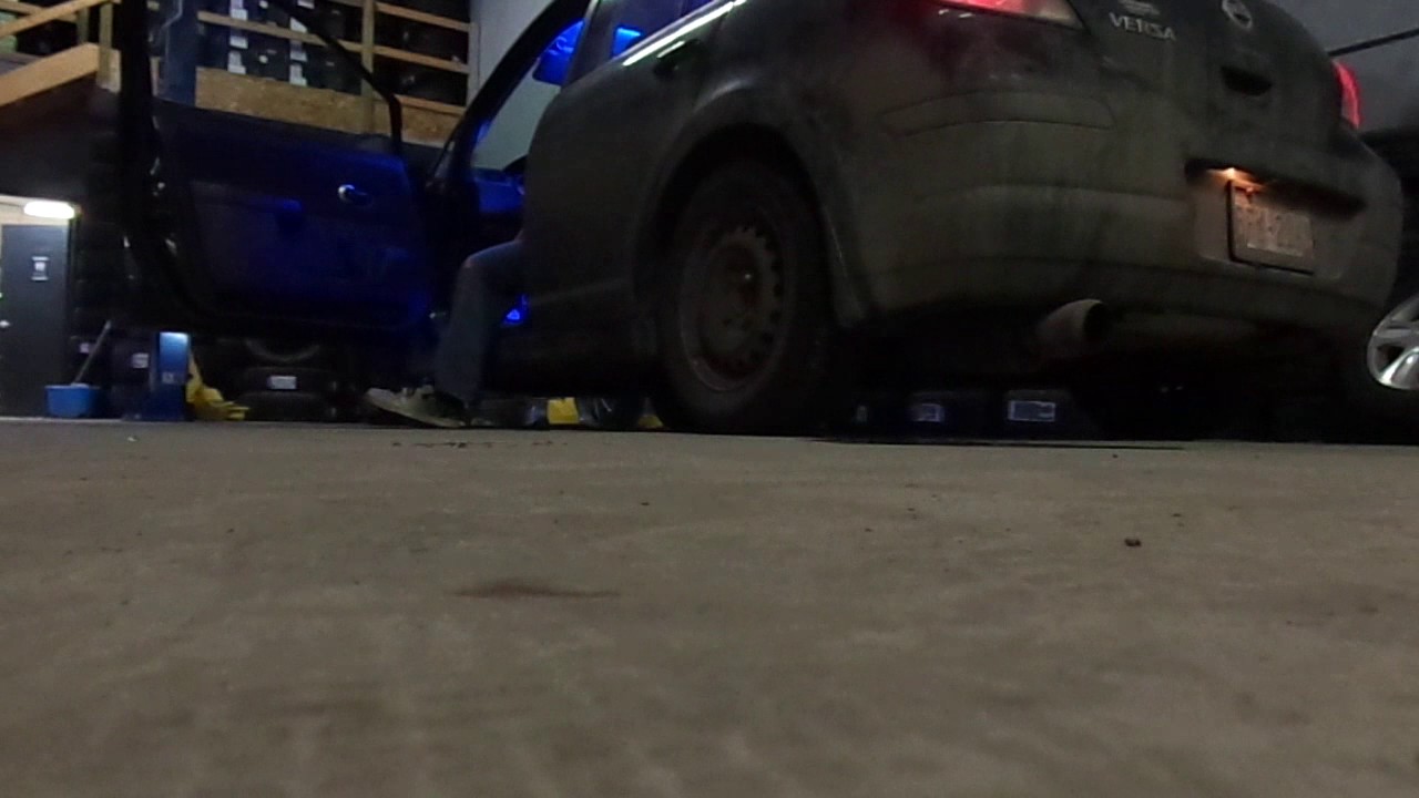 07 nissan versa open header exhaust and blue interrior lights - YouTube