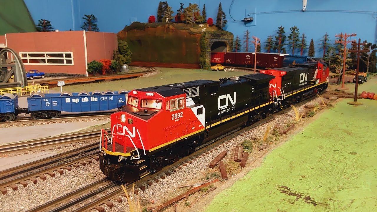 New trains and 2 trains going in the round house! - YouTube