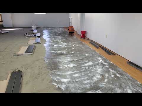 Applying pressure sensitive adhesive and dry time fir glue down LVT installation. - YouTube