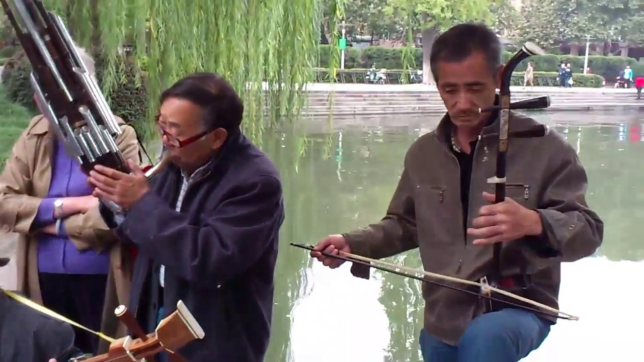 Playing Chinese musical instruments, and singing - YouTube