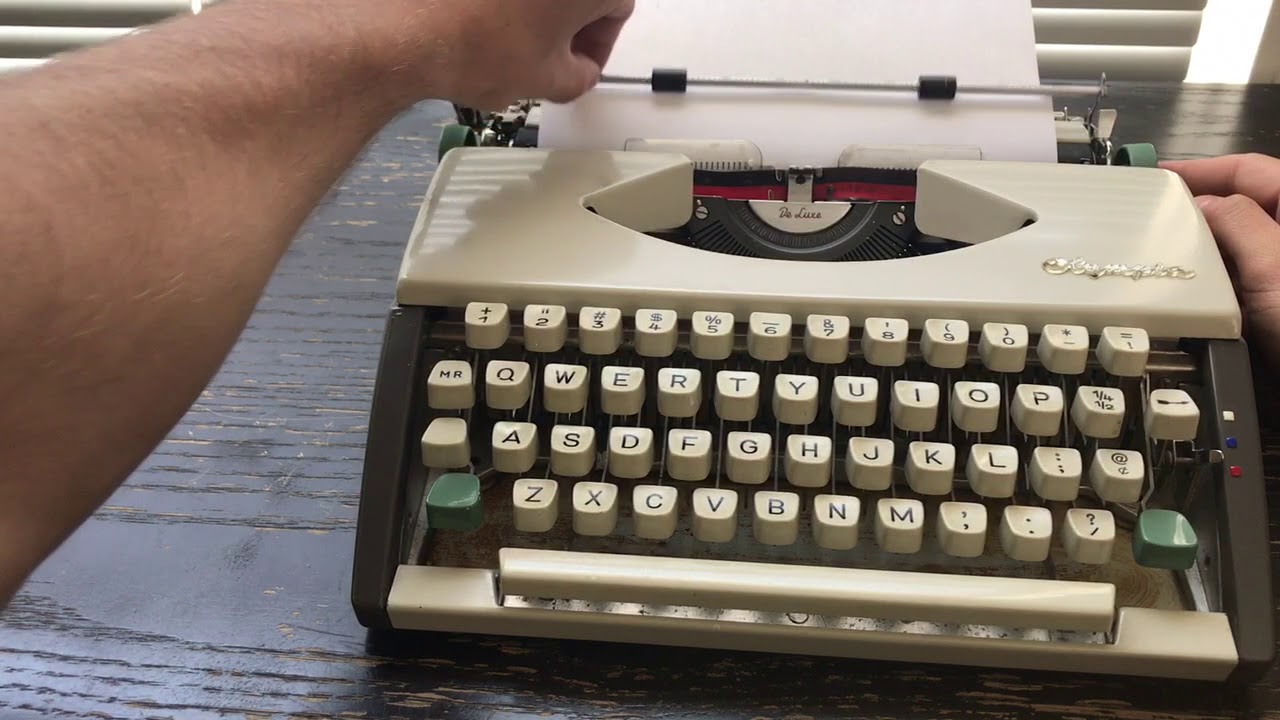 1966 Olympia SF DeLuxe Typewriter Cursive Script Ultraportable - YouTube