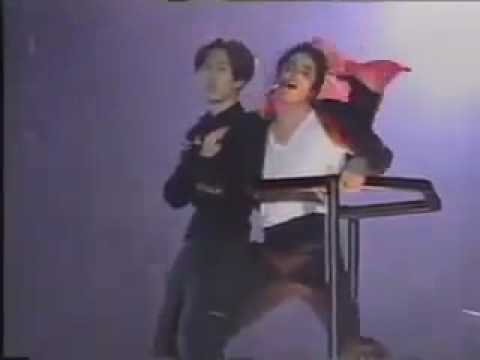 Korean fan jumps onto crane with Michael Jackson during Earth Song